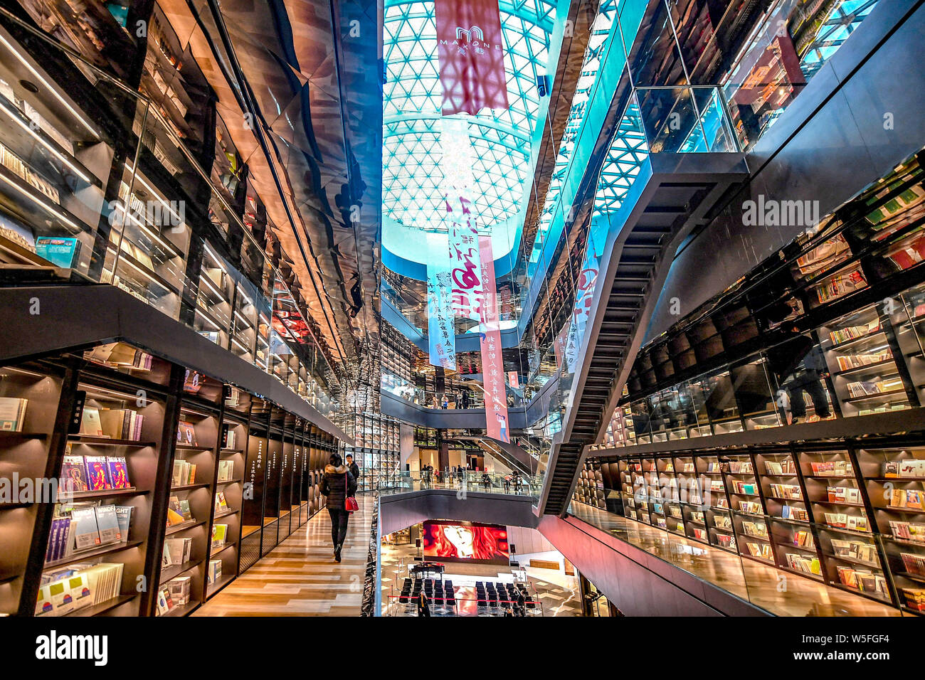 Books are on display on the giant book shelf, which spans 240 meters ...