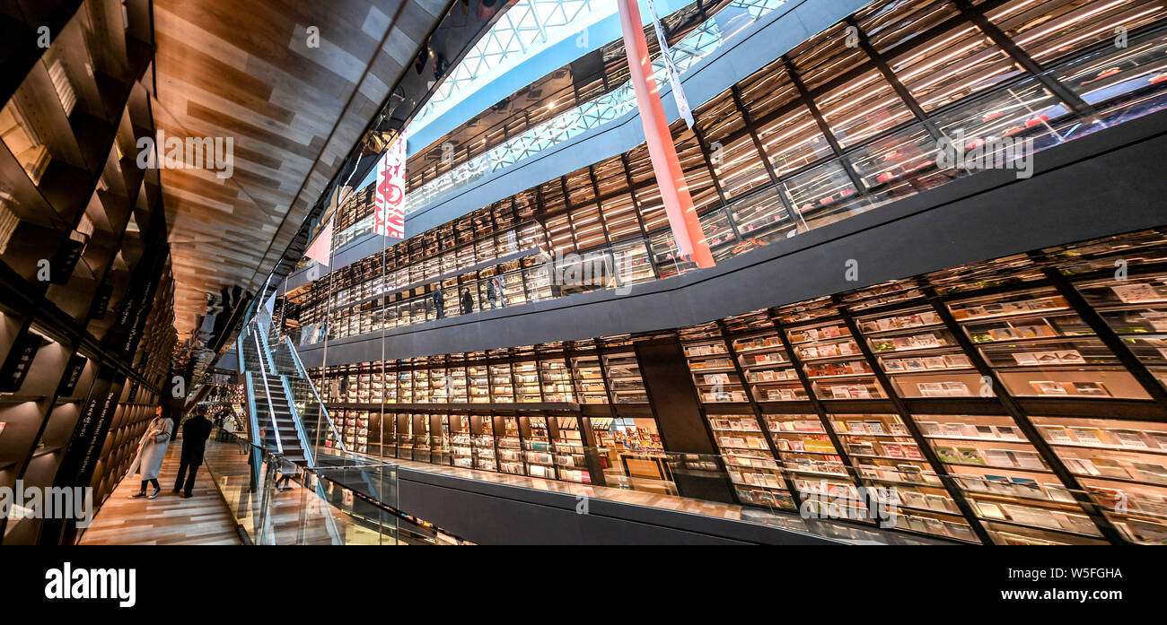 Books are on display on the giant book shelf, which spans 240 meters ...