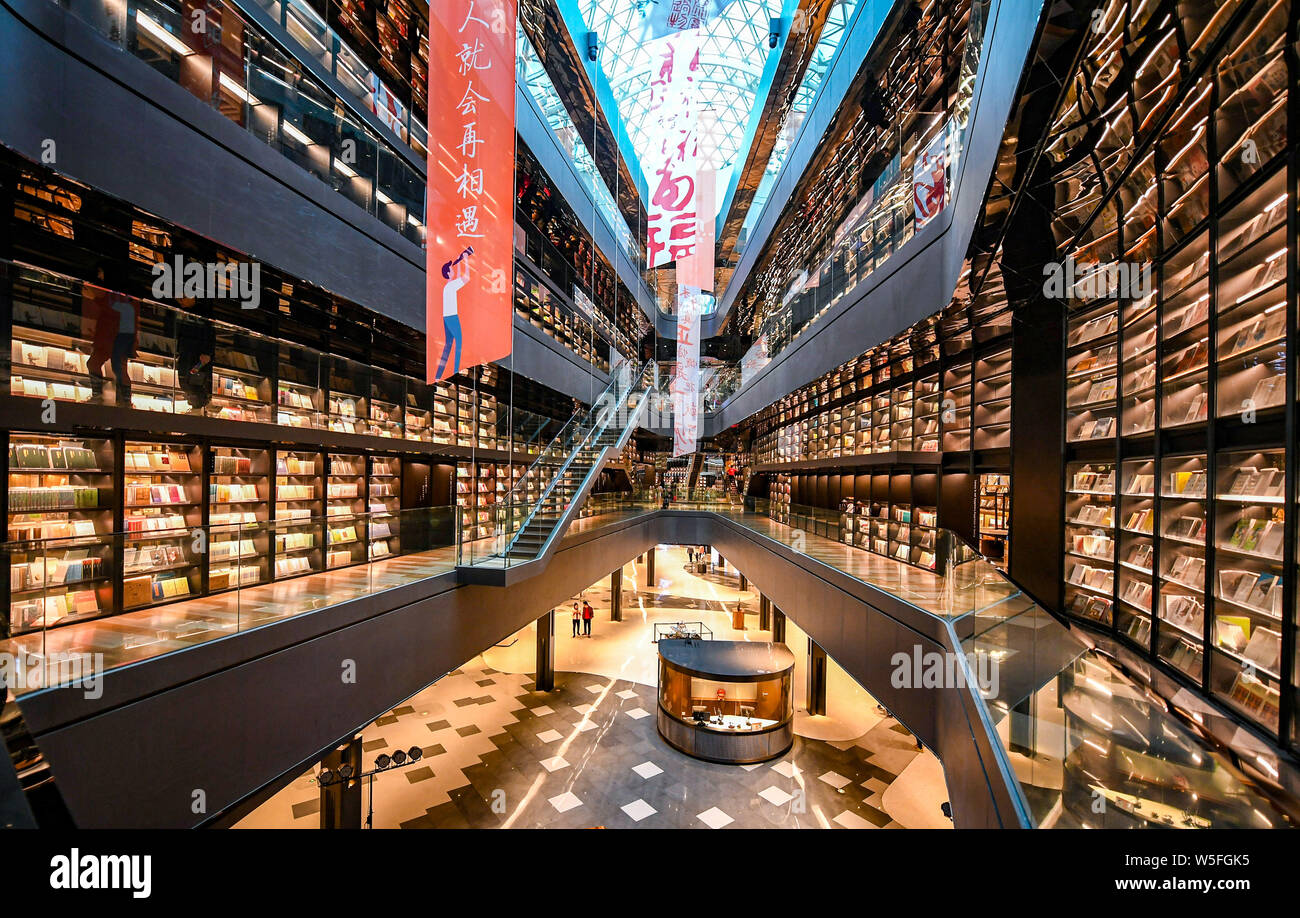 Books are on display on the giant book shelf, which spans 240 meters ...