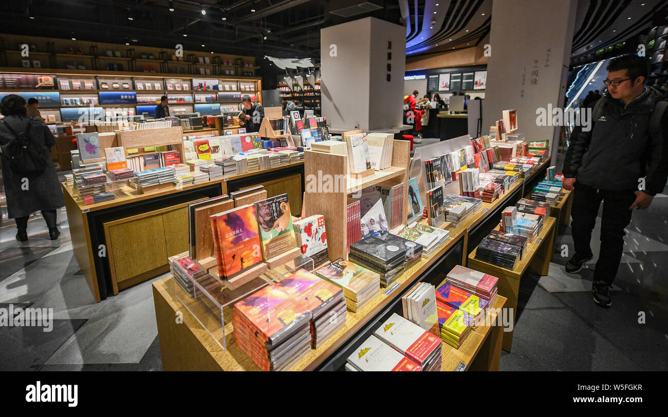 Books are on display on the giant book shelf, which spans 240 meters ...