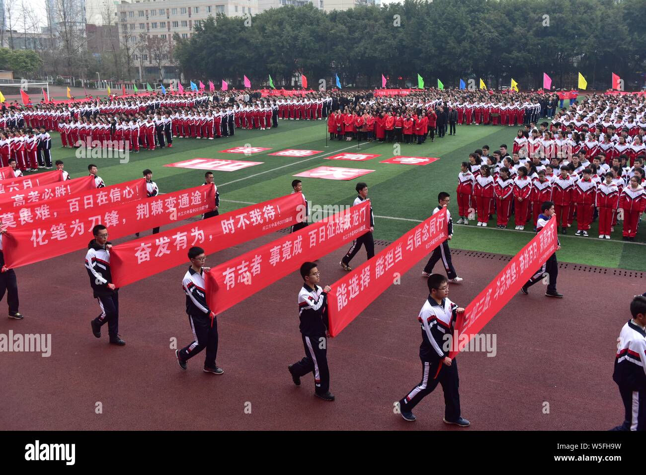 Chinese students queue up in lines during a mass rally for the upcoming ...