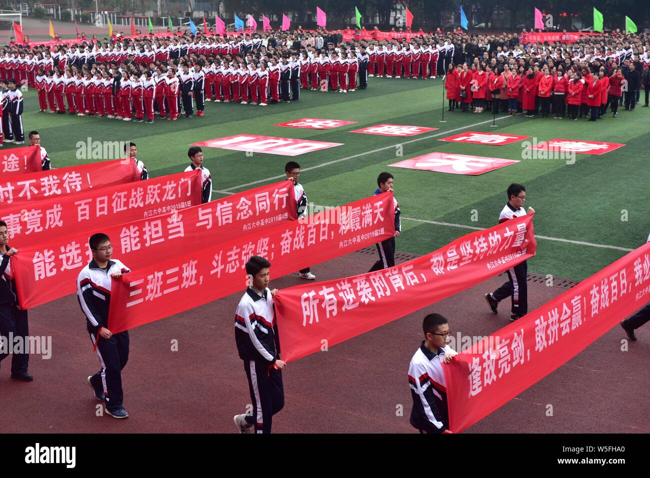 Chinese students queue up in lines during a mass rally for the upcoming ...