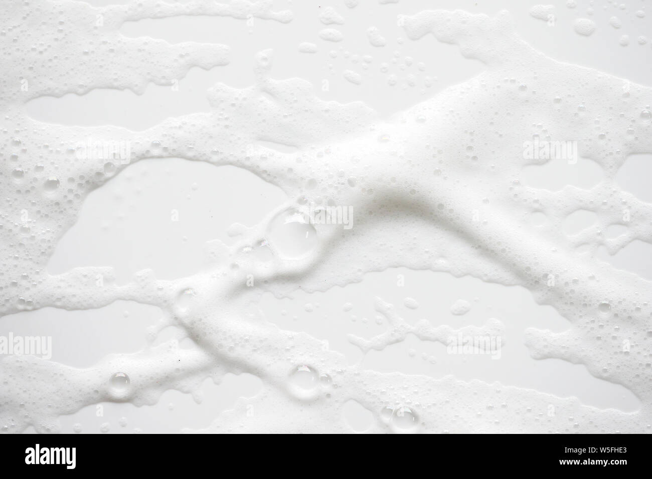 Abstract background white soapy foam texture. Shampoo foam with bubbles ...