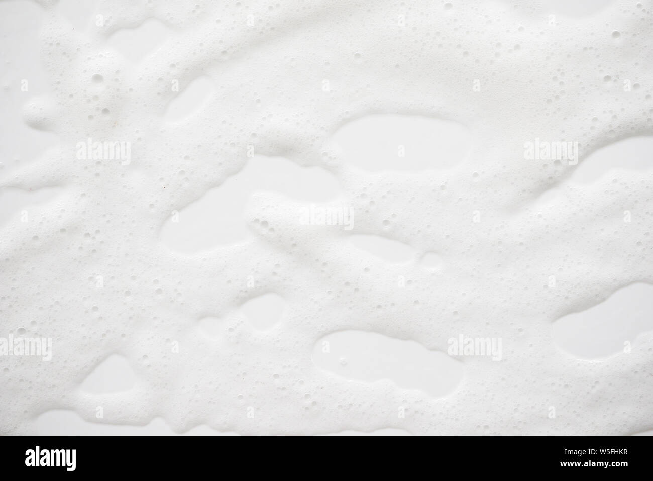 Abstract background white soapy foam texture. Shampoo foam with bubbles ...