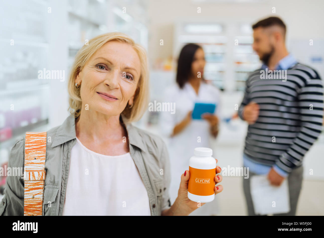 Cheerful senior woman demonstrating her personal choice Stock Photo - Alamy