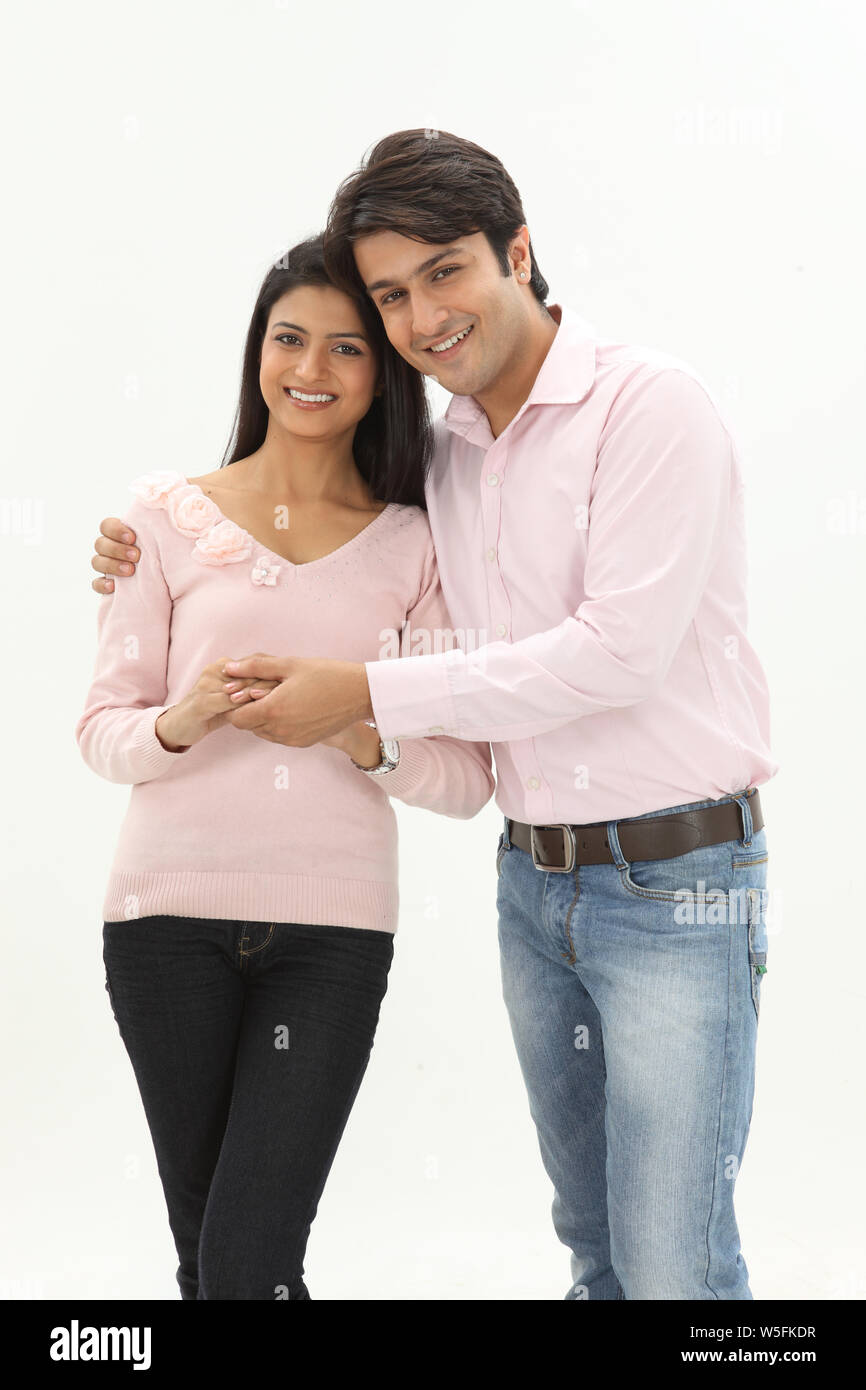 Couple standing together Stock Photo - Alamy