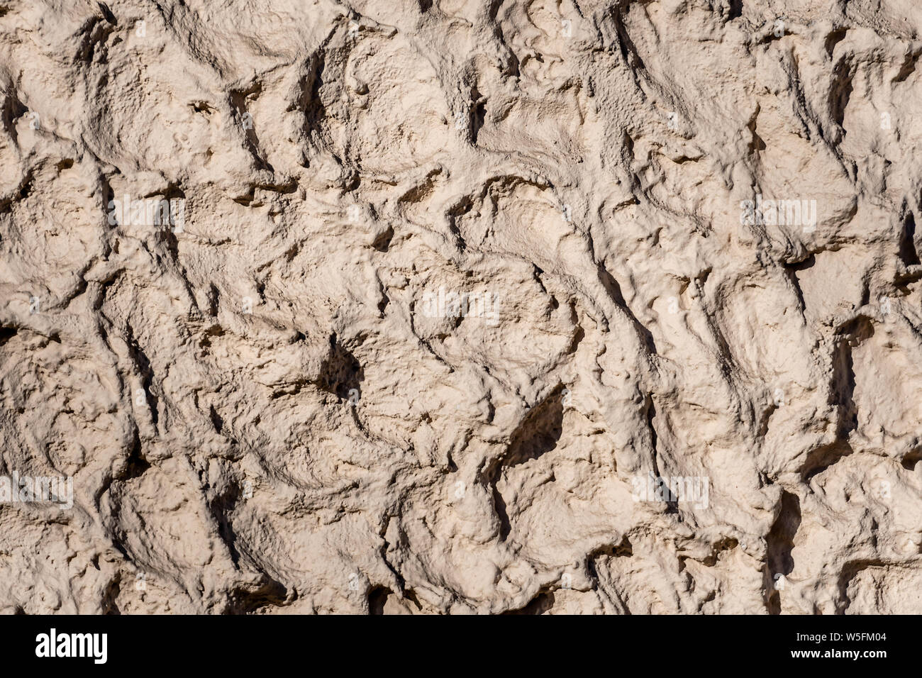 Decorative exterior wall plaster with embossed surface - image Stock ...