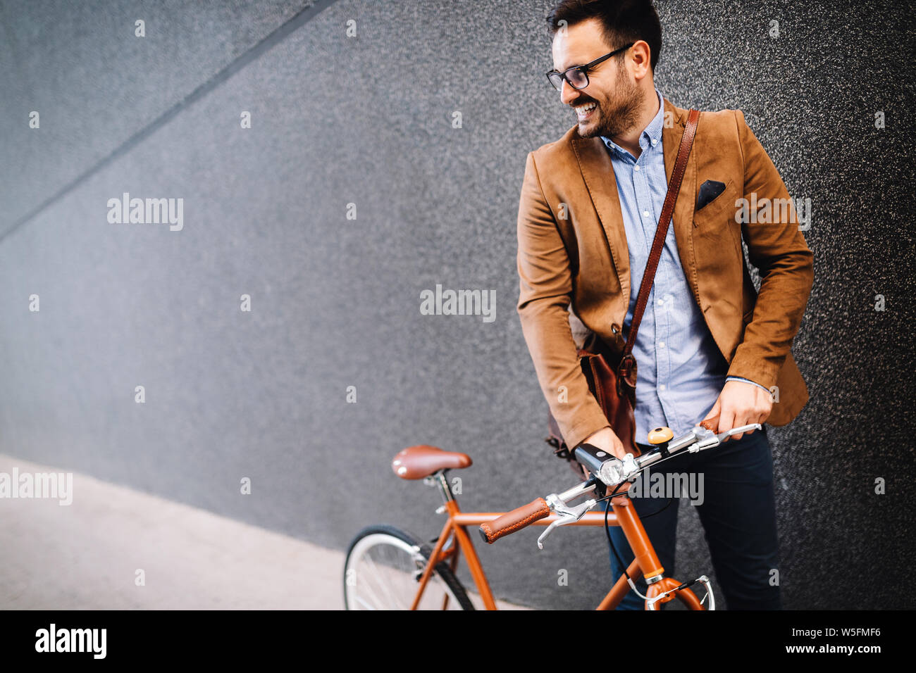 Man riding bicycle city suit hi-res stock photography and images - Alamy