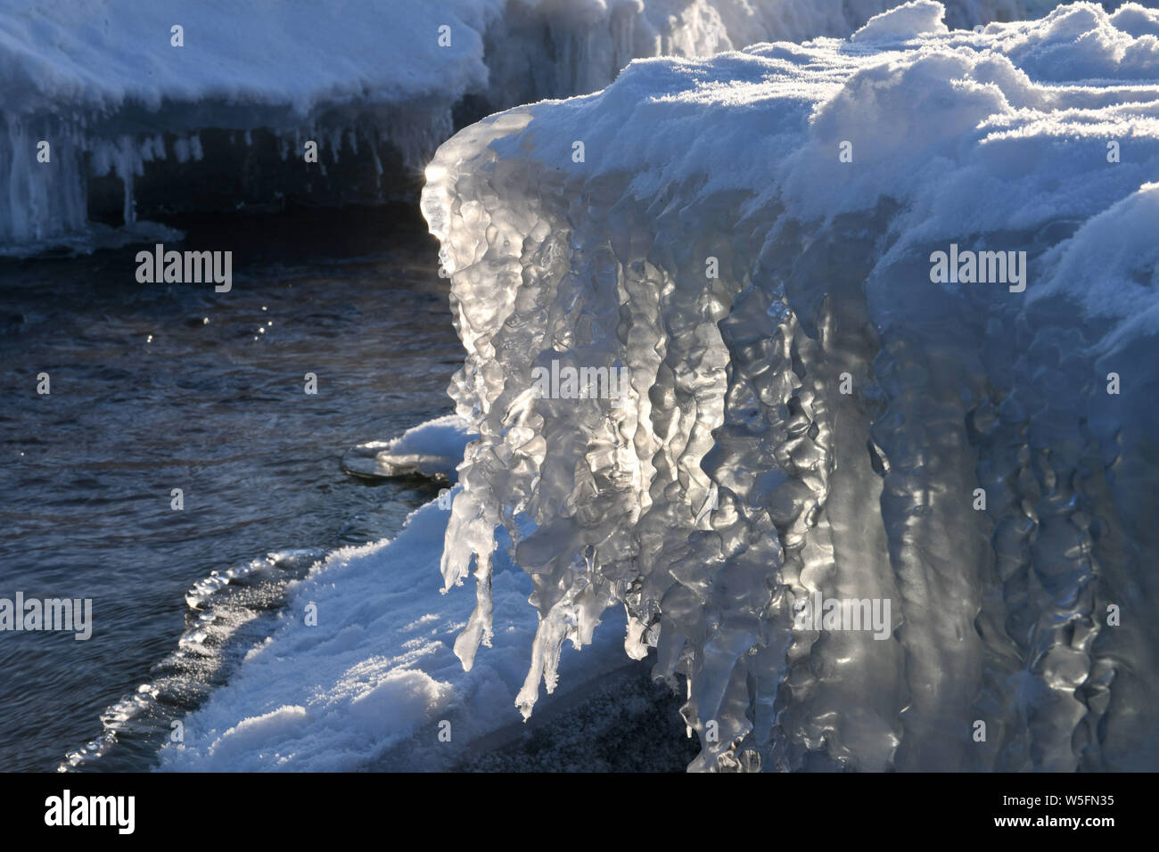 A snowy landscape of the scenic area of Zhadun River covered with snow ...