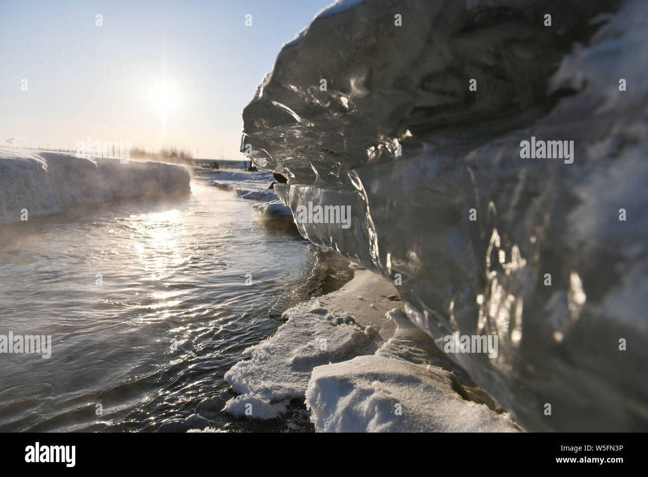 A snowy landscape of the scenic area of Zhadun River covered with snow ...