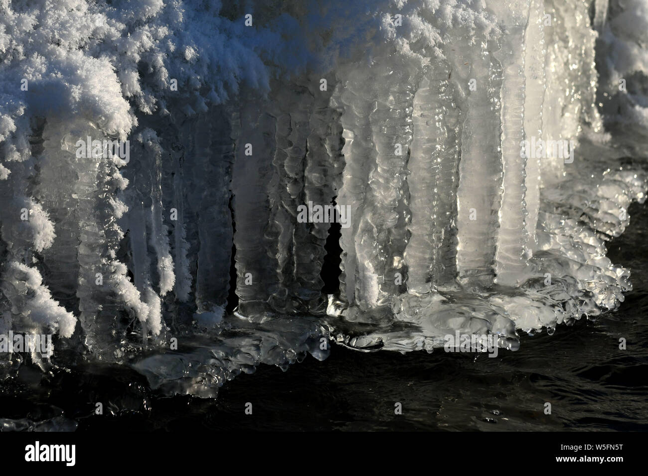 A snowy landscape of the scenic area of Zhadun River covered with snow ...