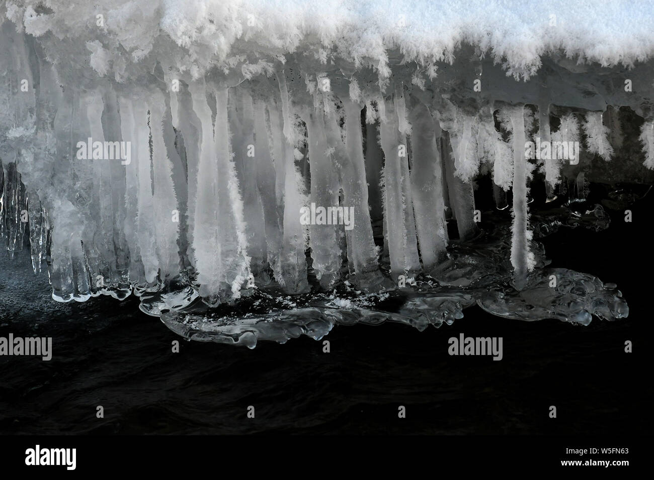 A snowy landscape of the scenic area of Zhadun River covered with snow ...