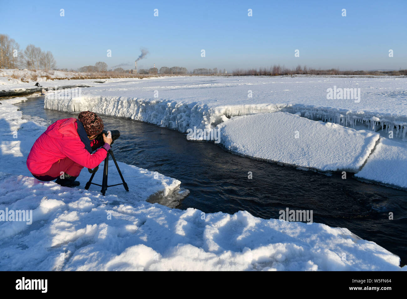 A snowy landscape of the scenic area of Zhadun River covered with snow ...