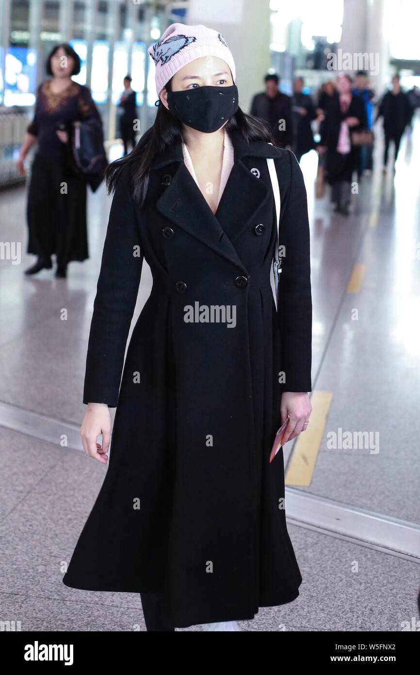Taiwanese actress Michelle Chen wearing a face mask arrives at the ...