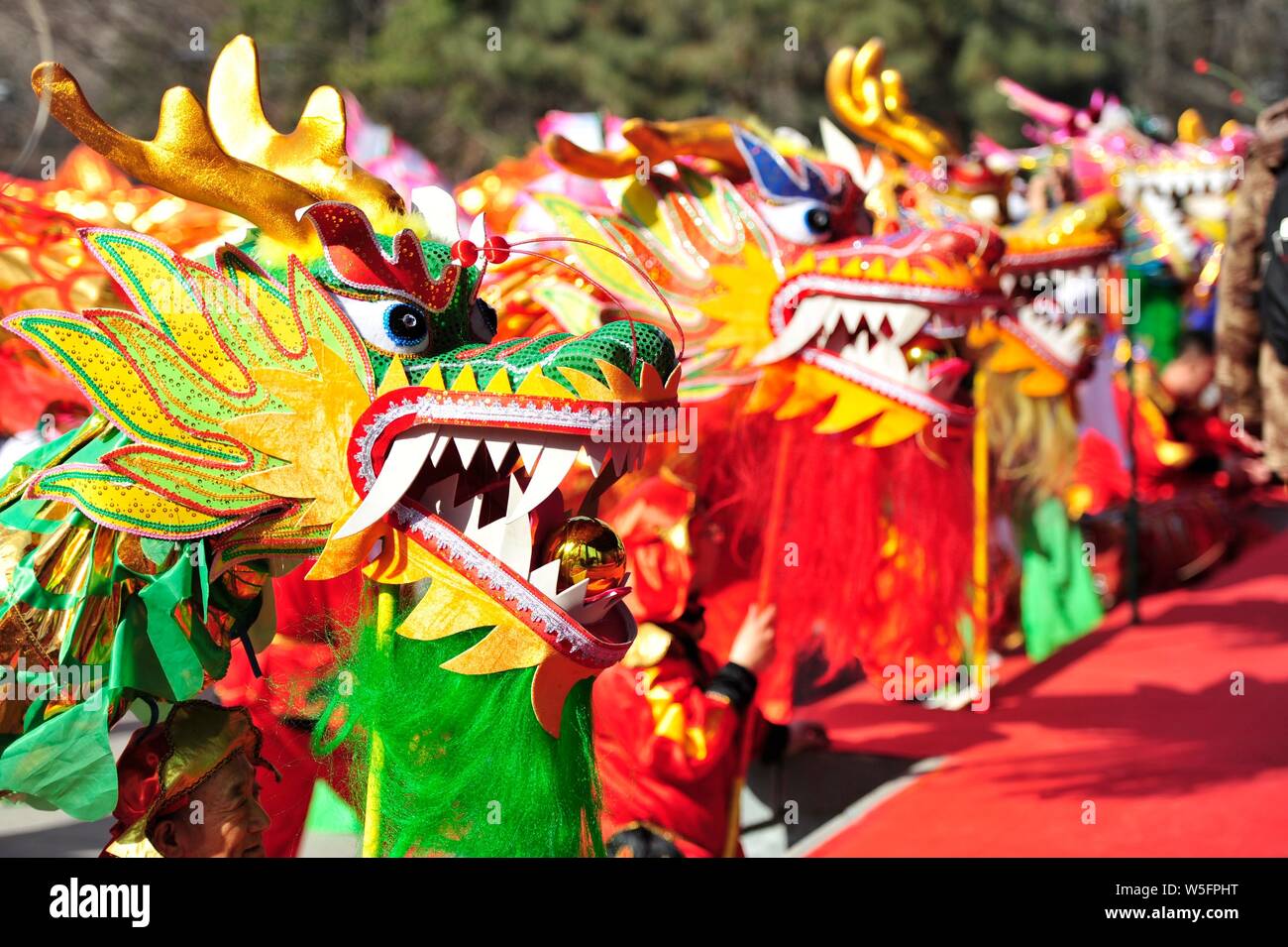 Chinese entertainers perform a dragon dance to celebrate the Dragon ...