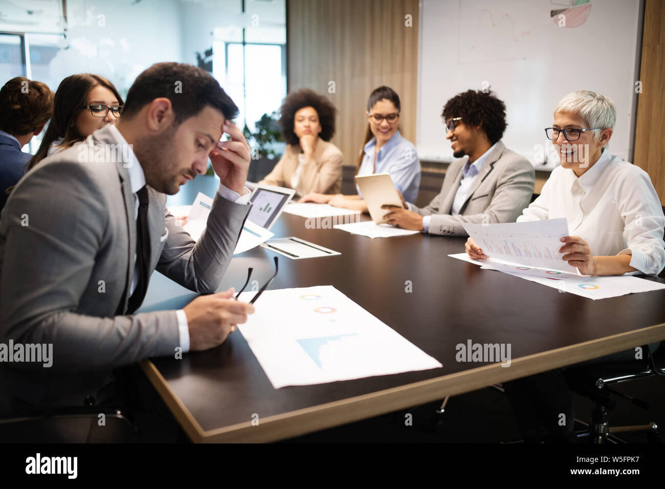 Corporate business team and manager in a meeting Stock Photo - Alamy