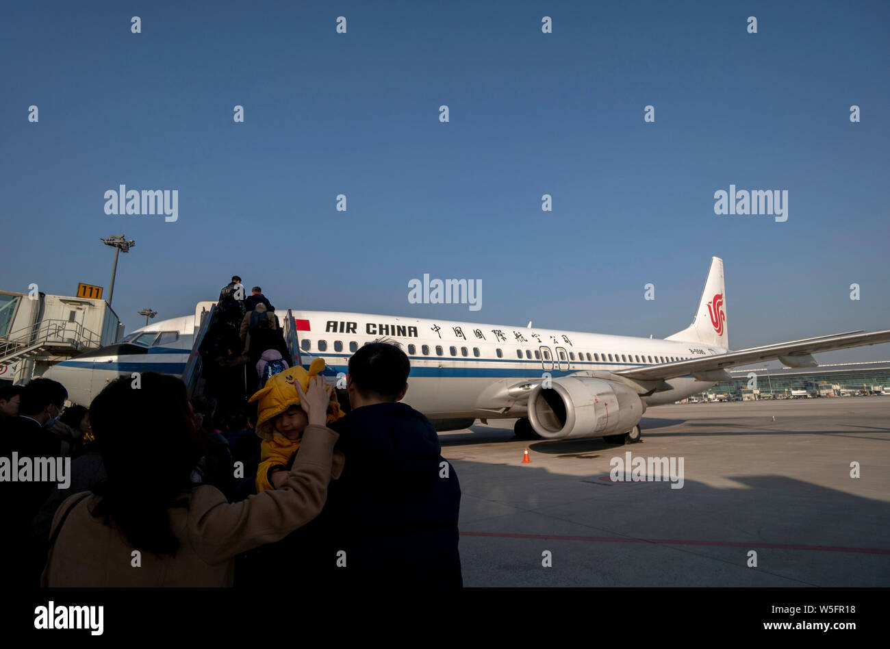 --FILE--A jet plane of Air China is parked at the Beijing Capital ...