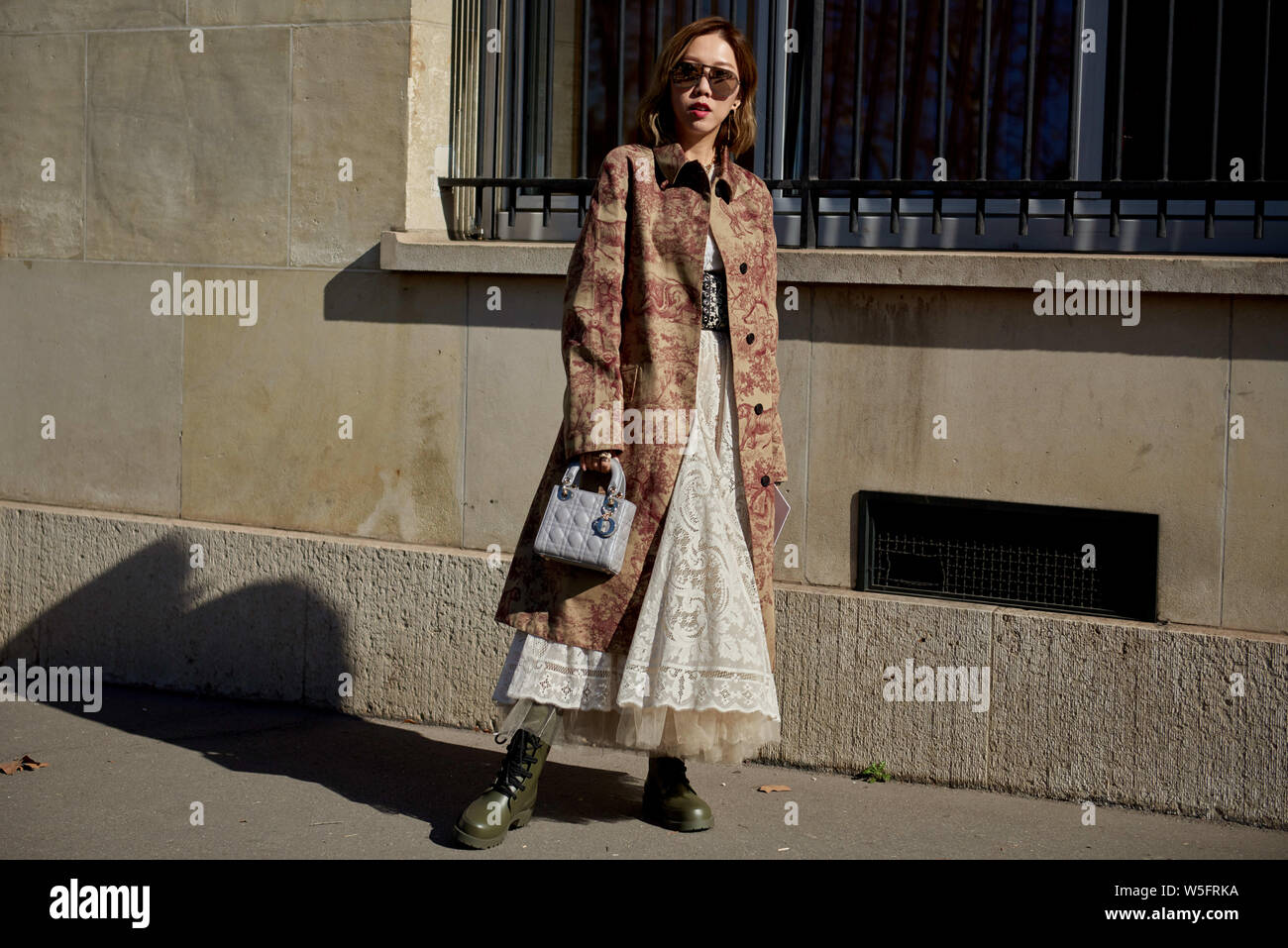 A trendy woman in fashionable outfit is pictured on the street during ...