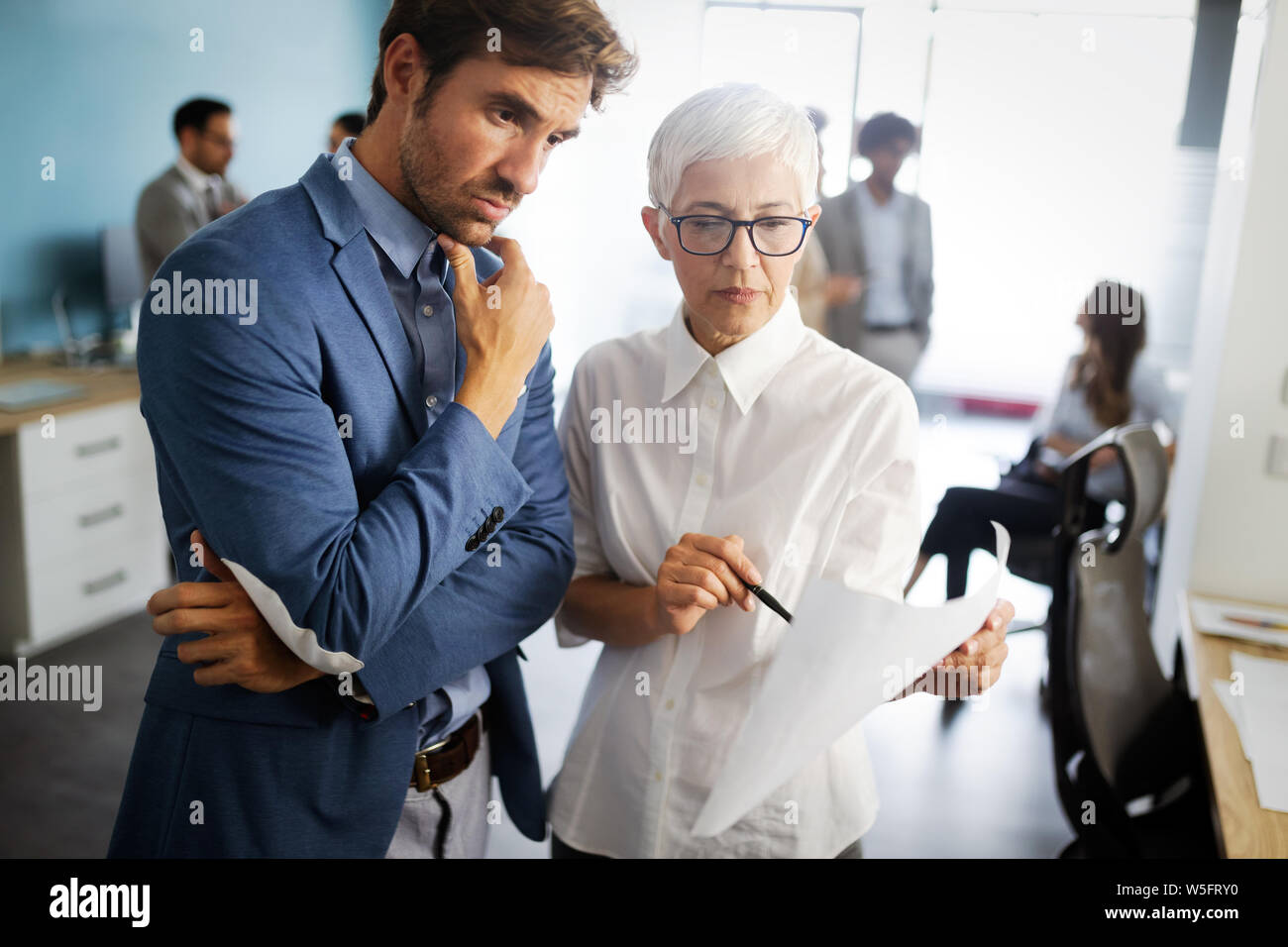 Group of successful business people at work in office Stock Photo - Alamy