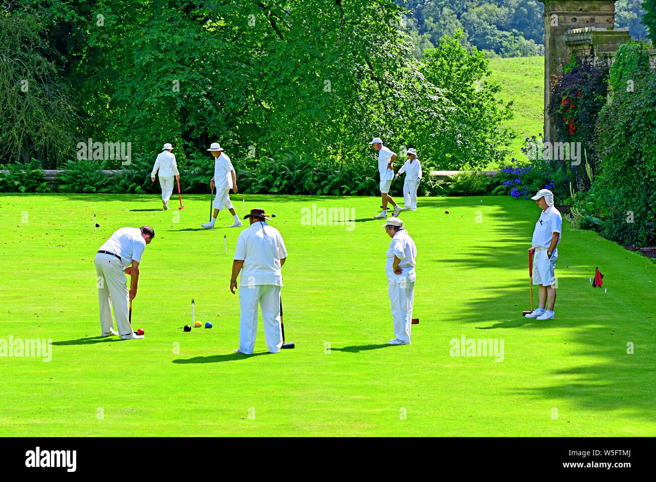 English Heritage Belsay Castle Northumberland croquet players Stock ...