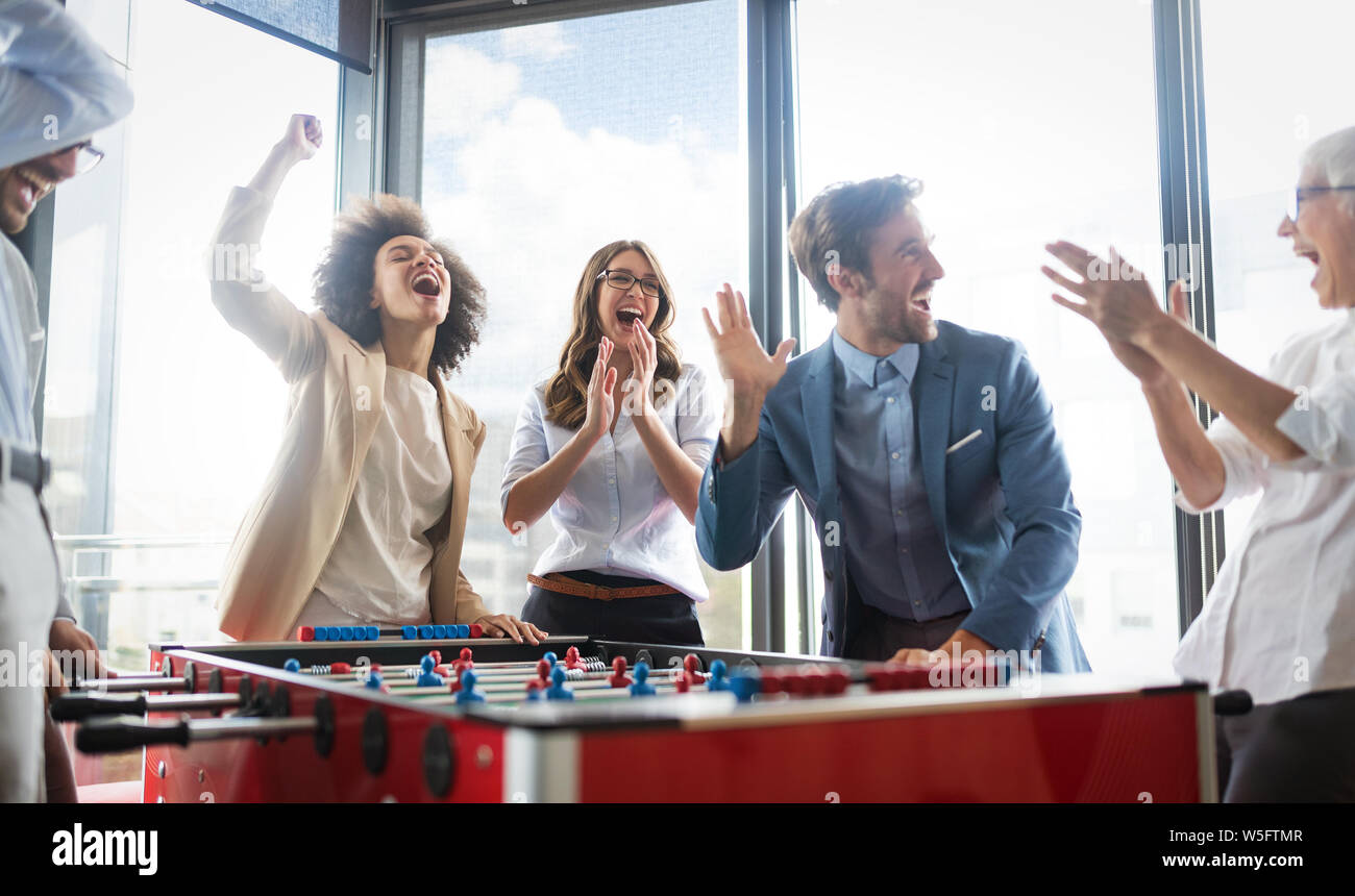 Business team celebrating a good job in the office Stock Photo - Alamy