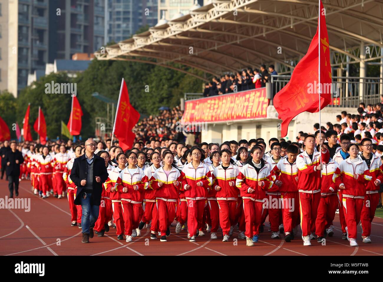 Chinese students queue up in lines during a mass rally for the upcoming ...