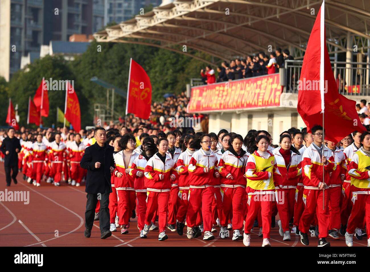 Chinese students queue up in lines during a mass rally for the upcoming ...