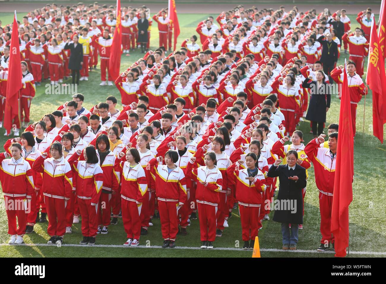 Chinese students queue up in lines during a mass rally for the upcoming ...