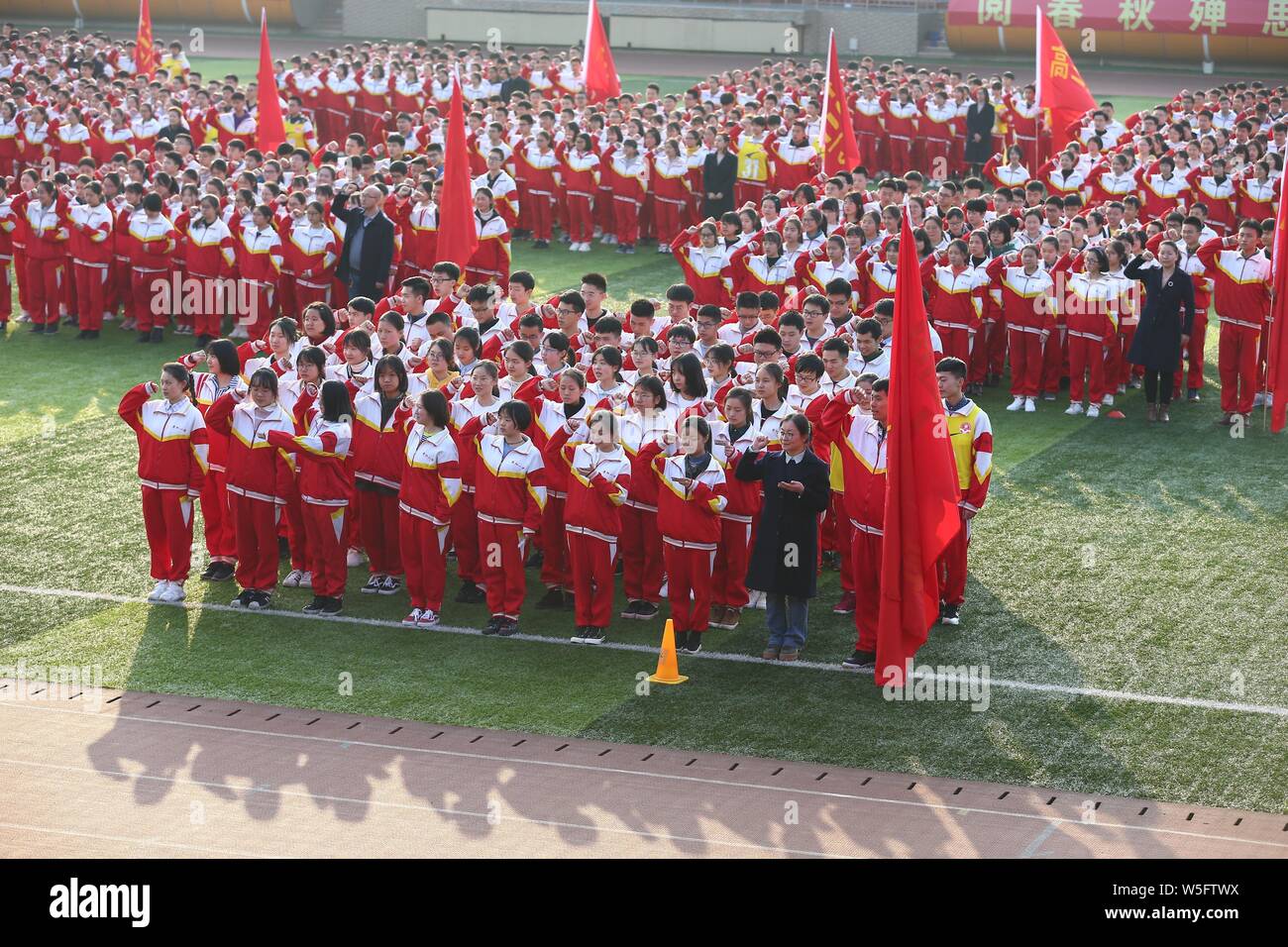 Chinese students queue up in lines during a mass rally for the upcoming ...