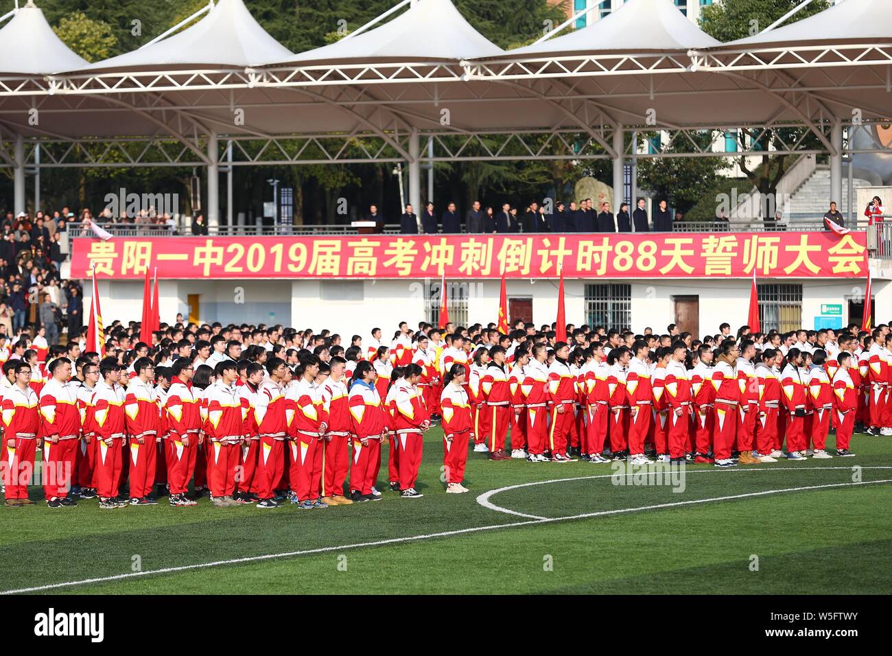 Chinese students queue up in lines during a mass rally for the upcoming ...