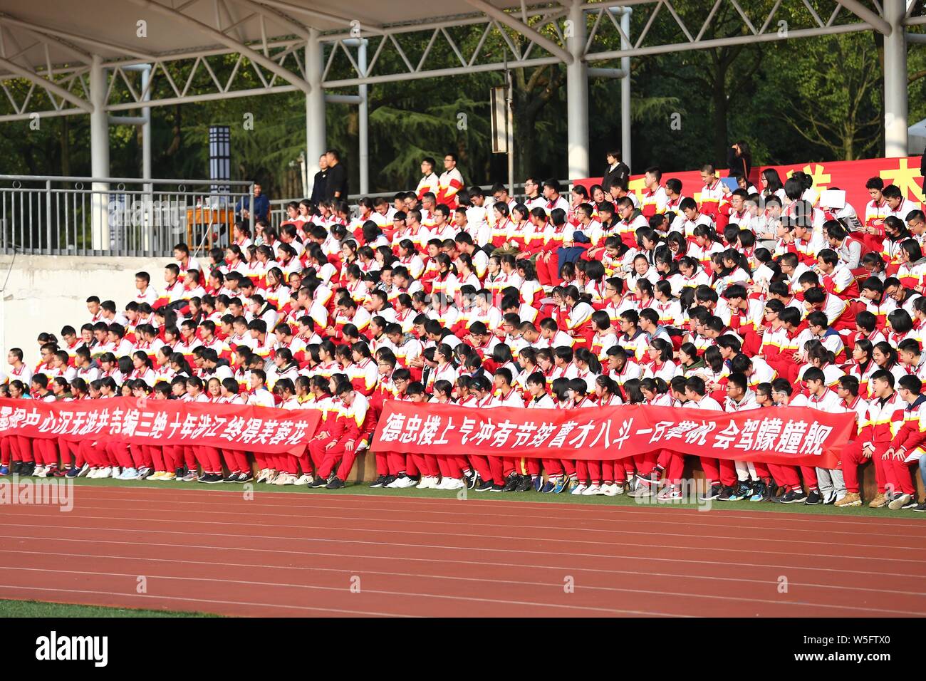 Chinese students queue up in lines during a mass rally for the upcoming ...