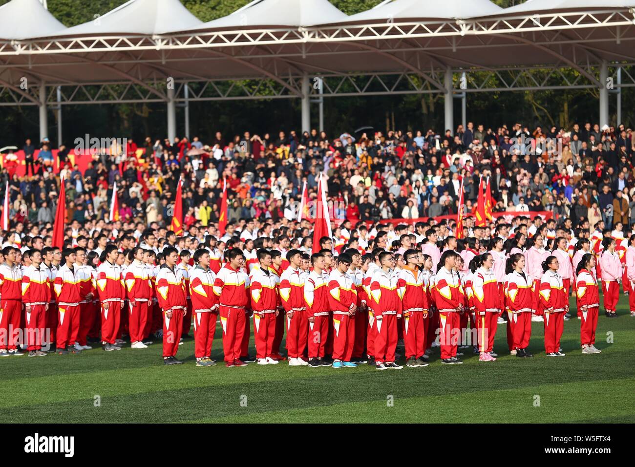 Chinese students queue up in lines during a mass rally for the upcoming ...