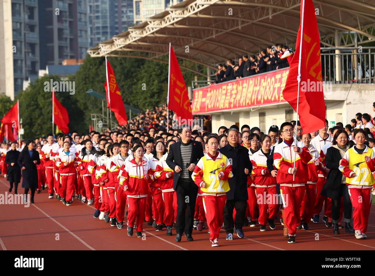 Chinese students queue up in lines during a mass rally for the upcoming ...