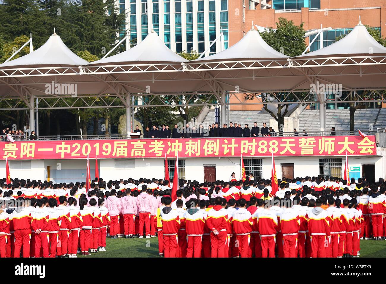 Chinese students queue up in lines during a mass rally for the upcoming ...