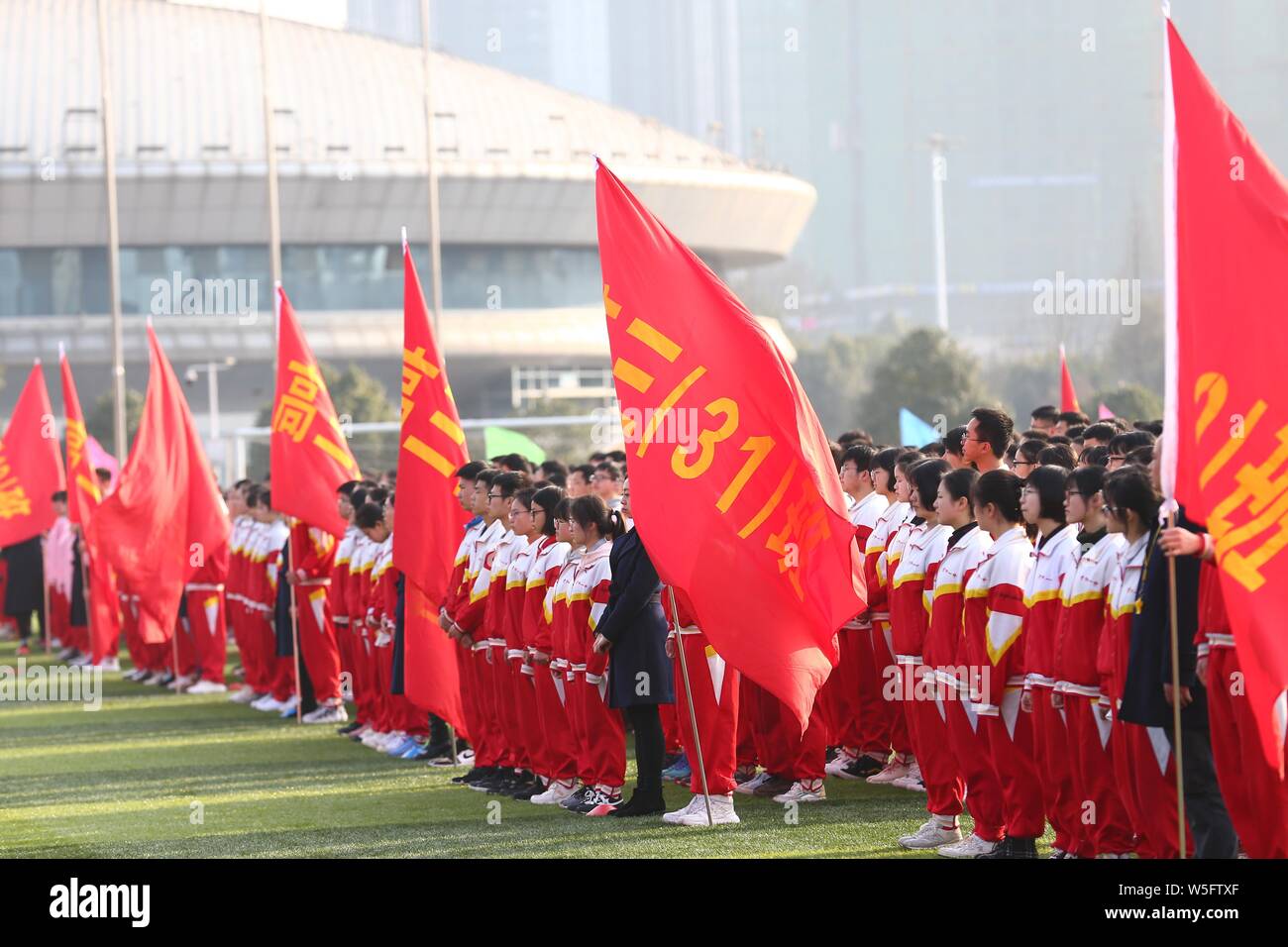Chinese students queue up in lines during a mass rally for the upcoming ...