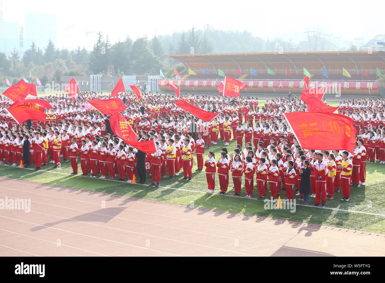 Chinese students queue up in lines during a mass rally for the upcoming ...