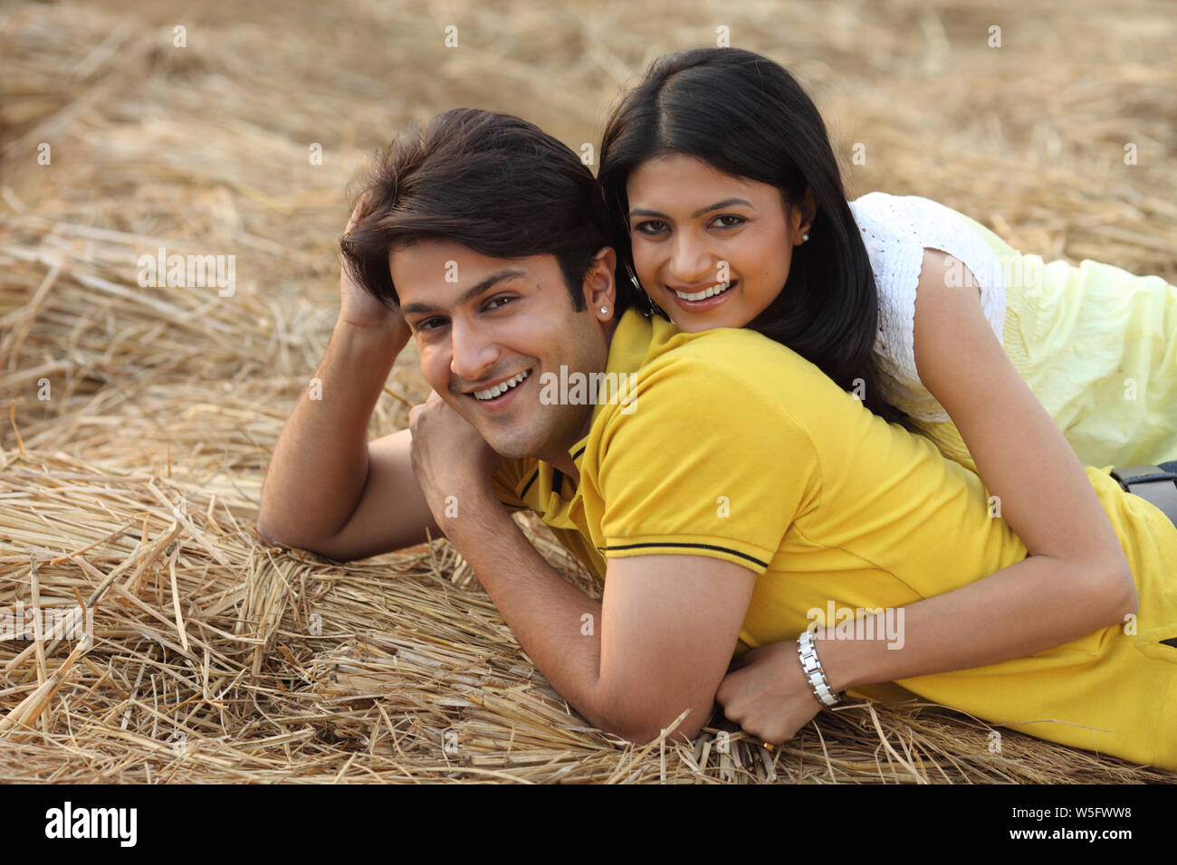 Couple romancing and smiling Stock Photo - Alamy