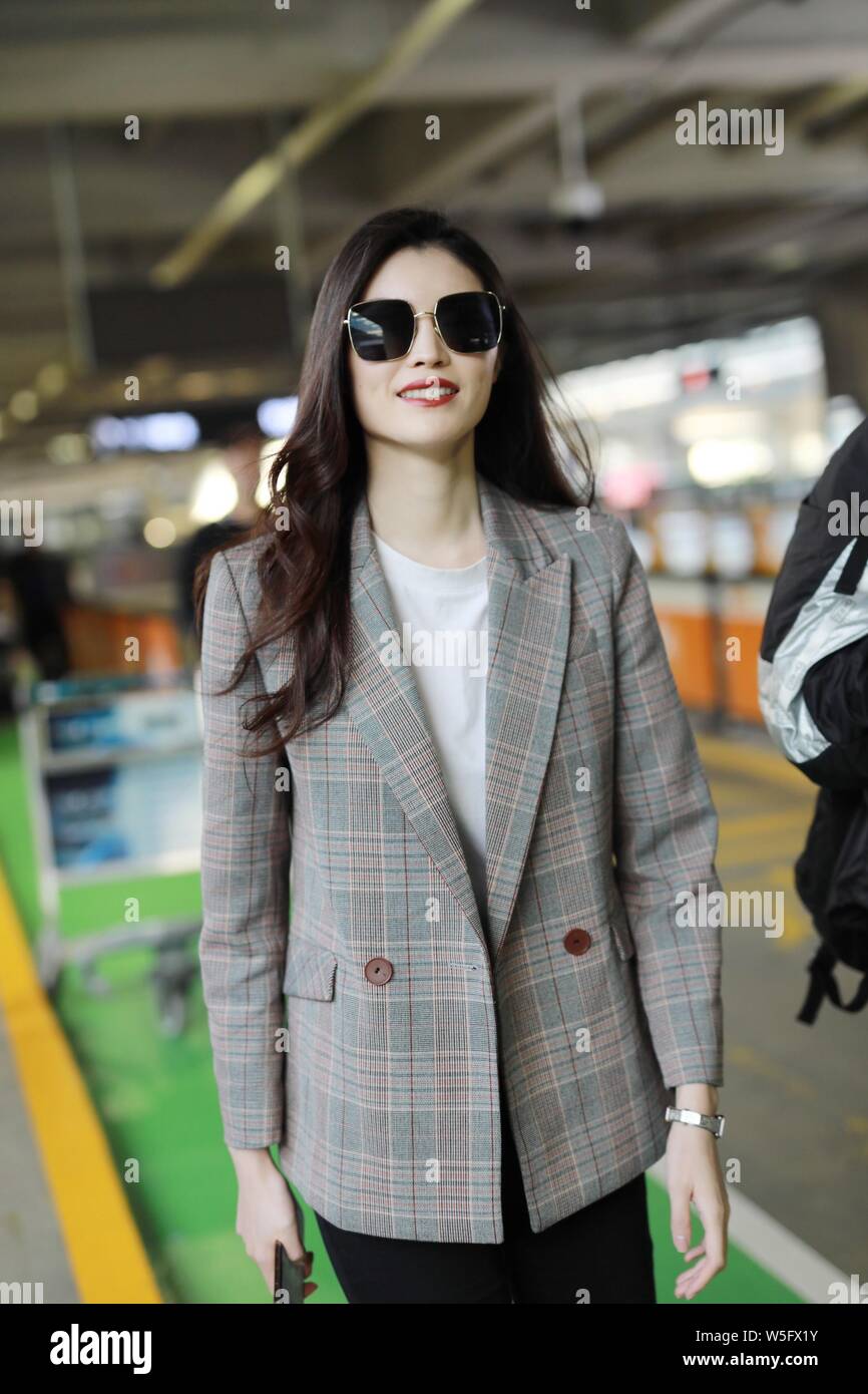 Chinese supermodel He Sui leaves the terminal after landing at the ...
