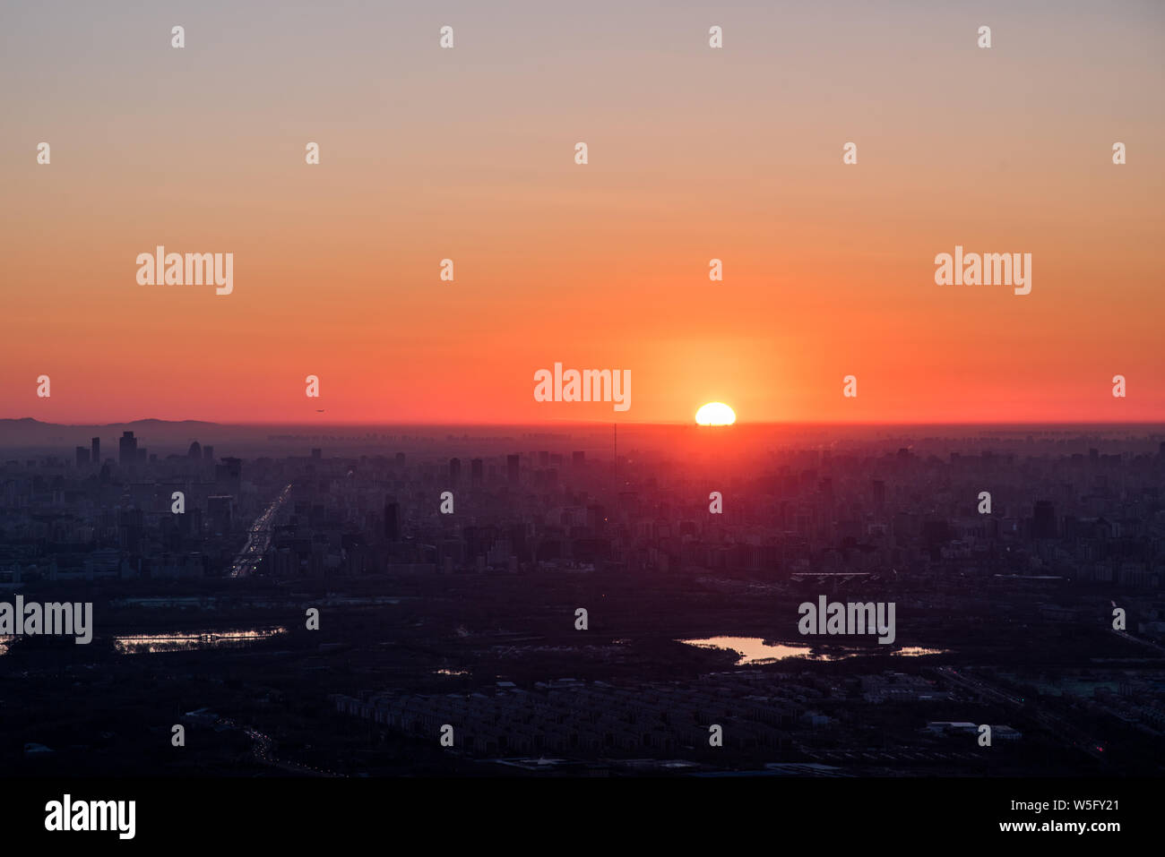 Skyline of the high-rising buildings and skyscrapers at sunrise in ...