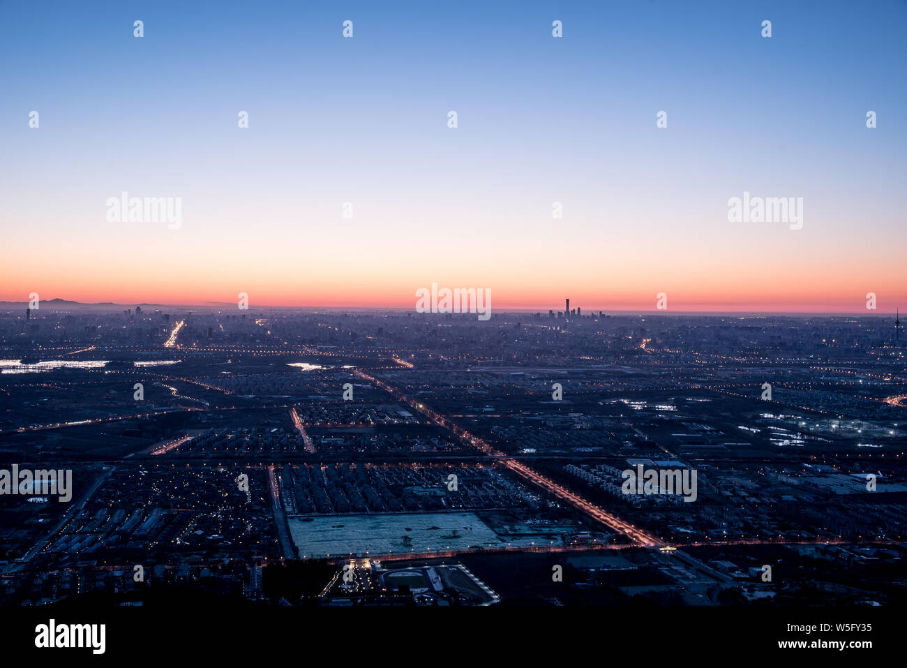 Skyline of the high-rising buildings and skyscrapers at sunrise in ...