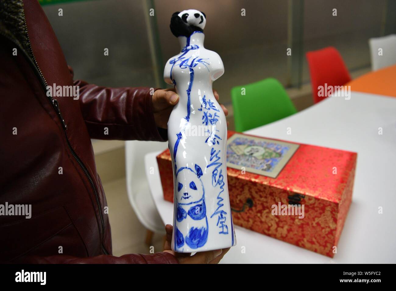 The Cheongsam-shaped porcelain and panda poo tea are donated by An ...