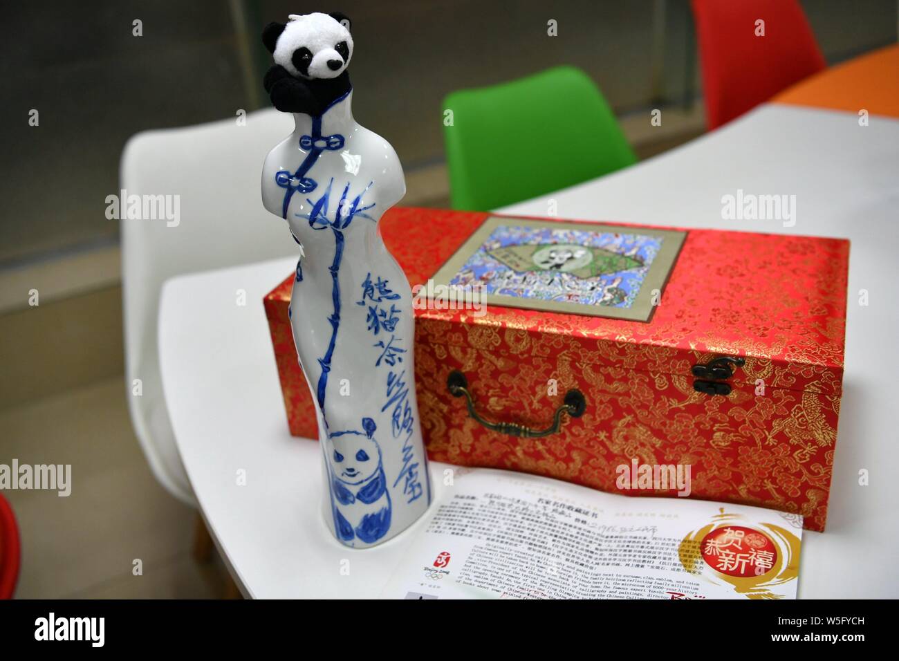 The Cheongsam-shaped porcelain and panda poo tea are donated by An ...