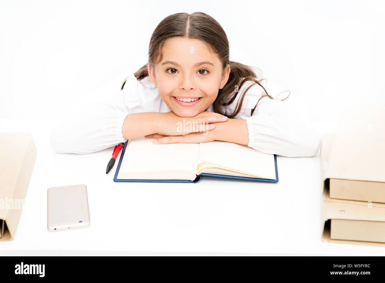 Homeschooling. dictionary notebook. Get information. cheerful girl with ...