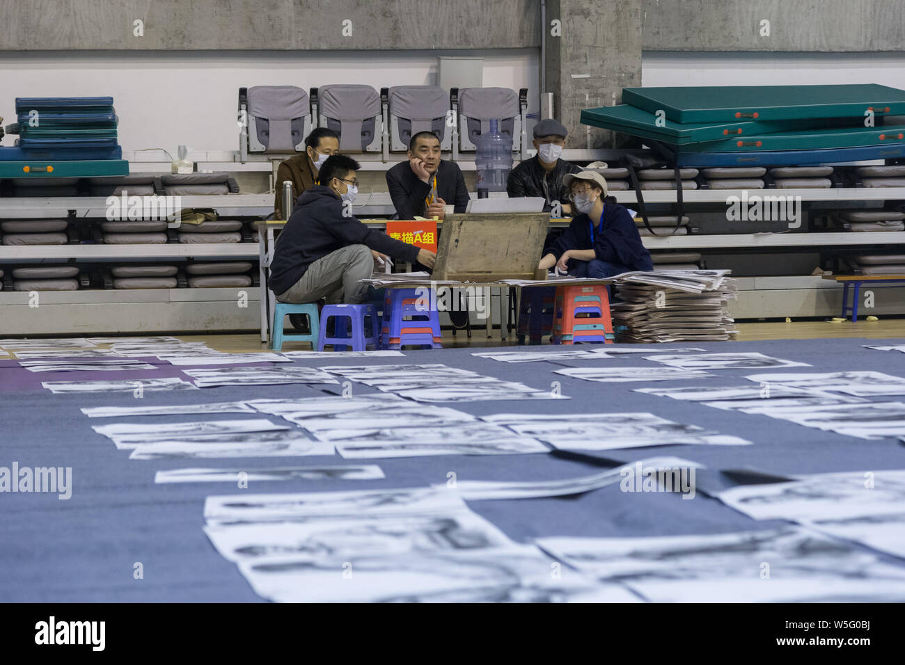 Teachers from China Academy of Art view the sketches completed by ...