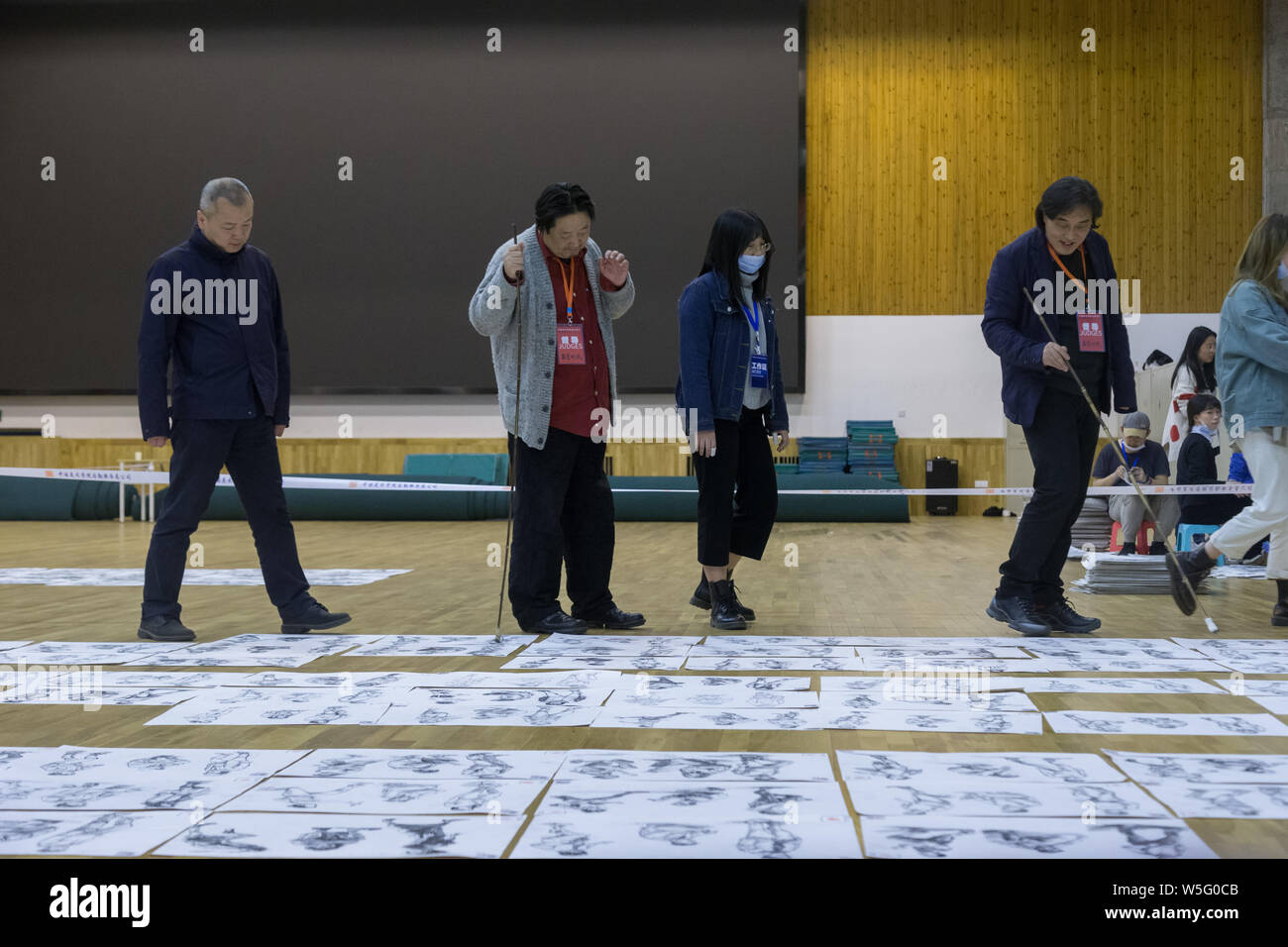 Teachers from China Academy of Art view the sketches completed by ...