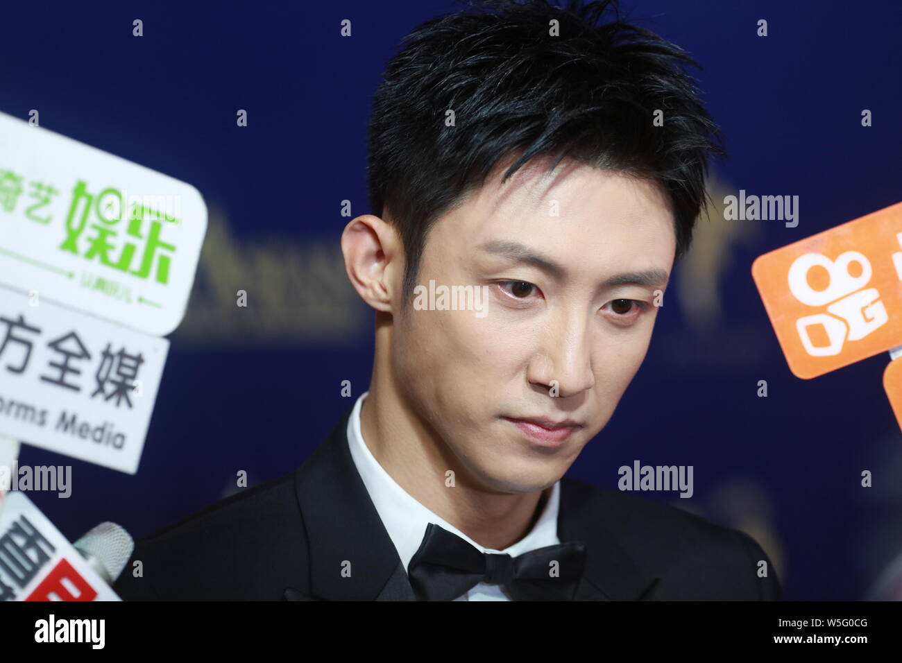 Chinese actor Huang Jingyu arrives on the red carpet for the 13th Asian ...