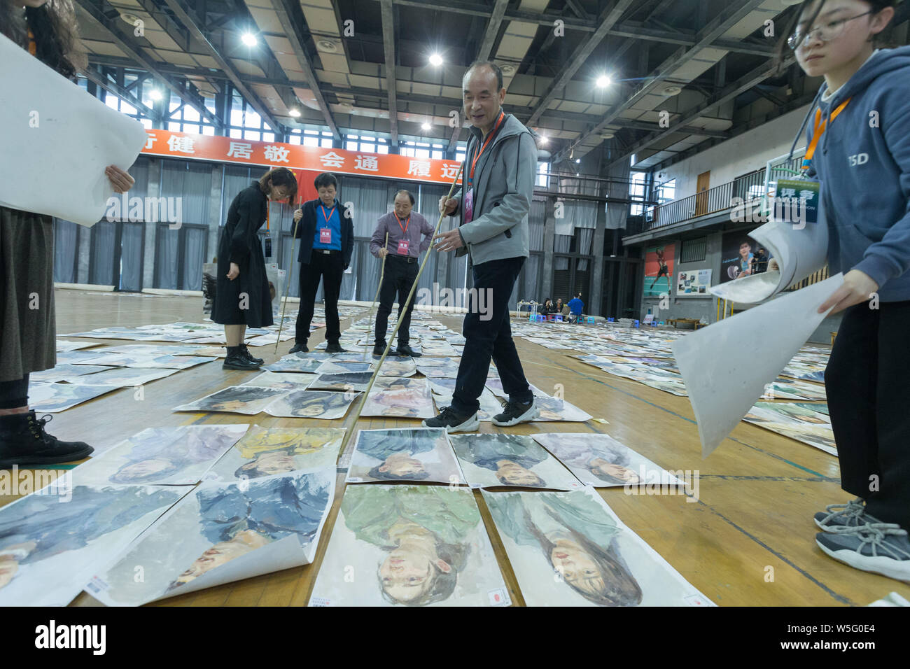 Teachers from China Academy of Art view the sketches completed by ...