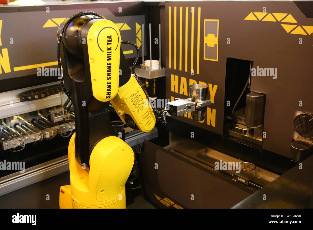 A robot arm makes milk tea at an automated store in Shanghai, China, 17 ...