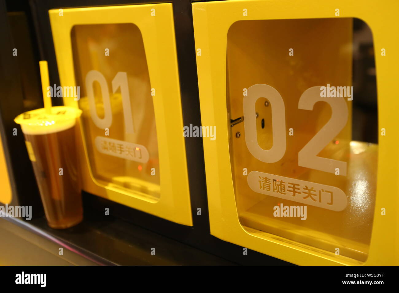 A robot arm makes milk tea at an automated store in Shanghai, China, 17 ...