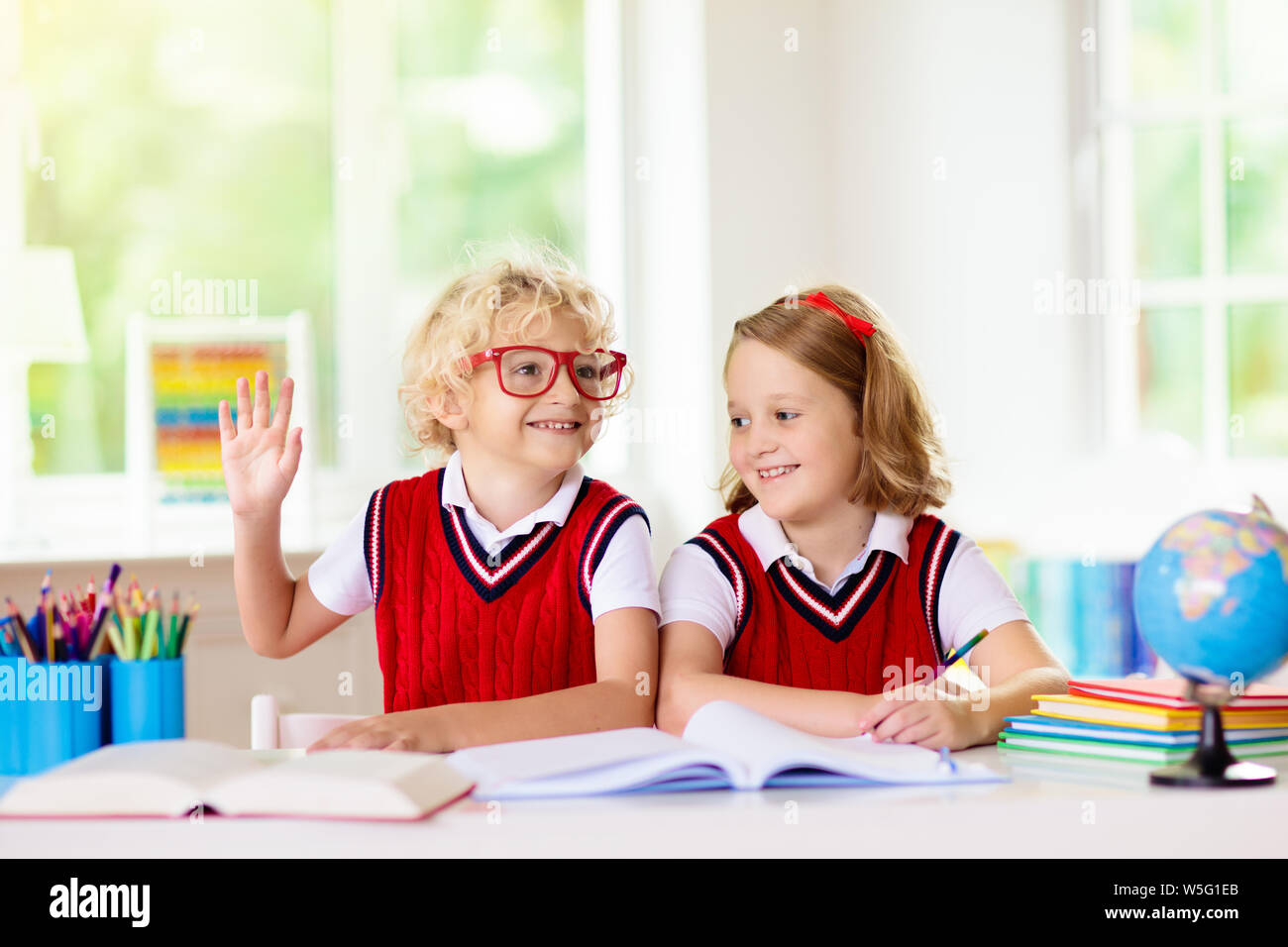 Kids go back to school. Children study and learn for preschool. Boy and ...